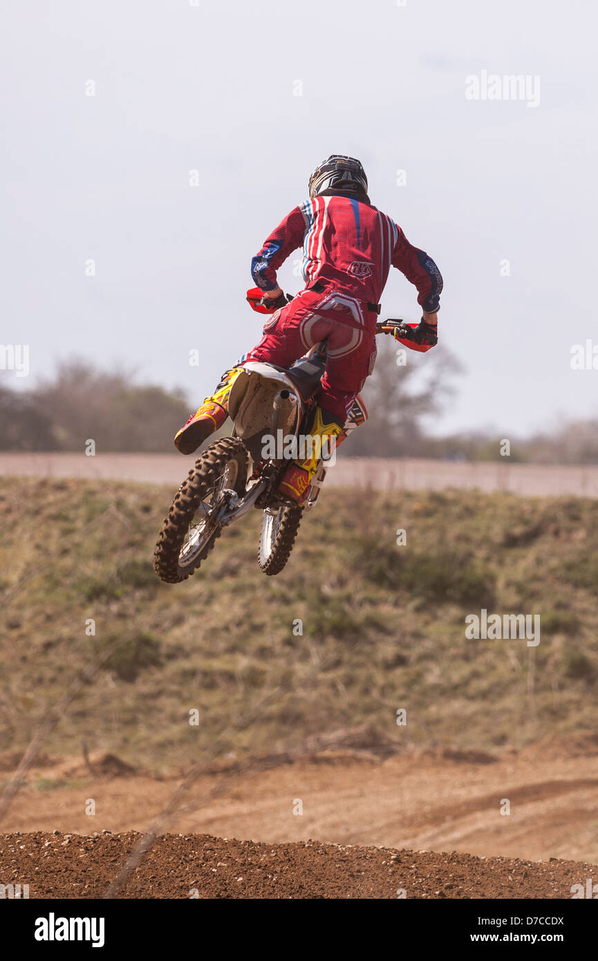 A motocross bike scrambler jumping in the Uk Stock Photo - Alamy