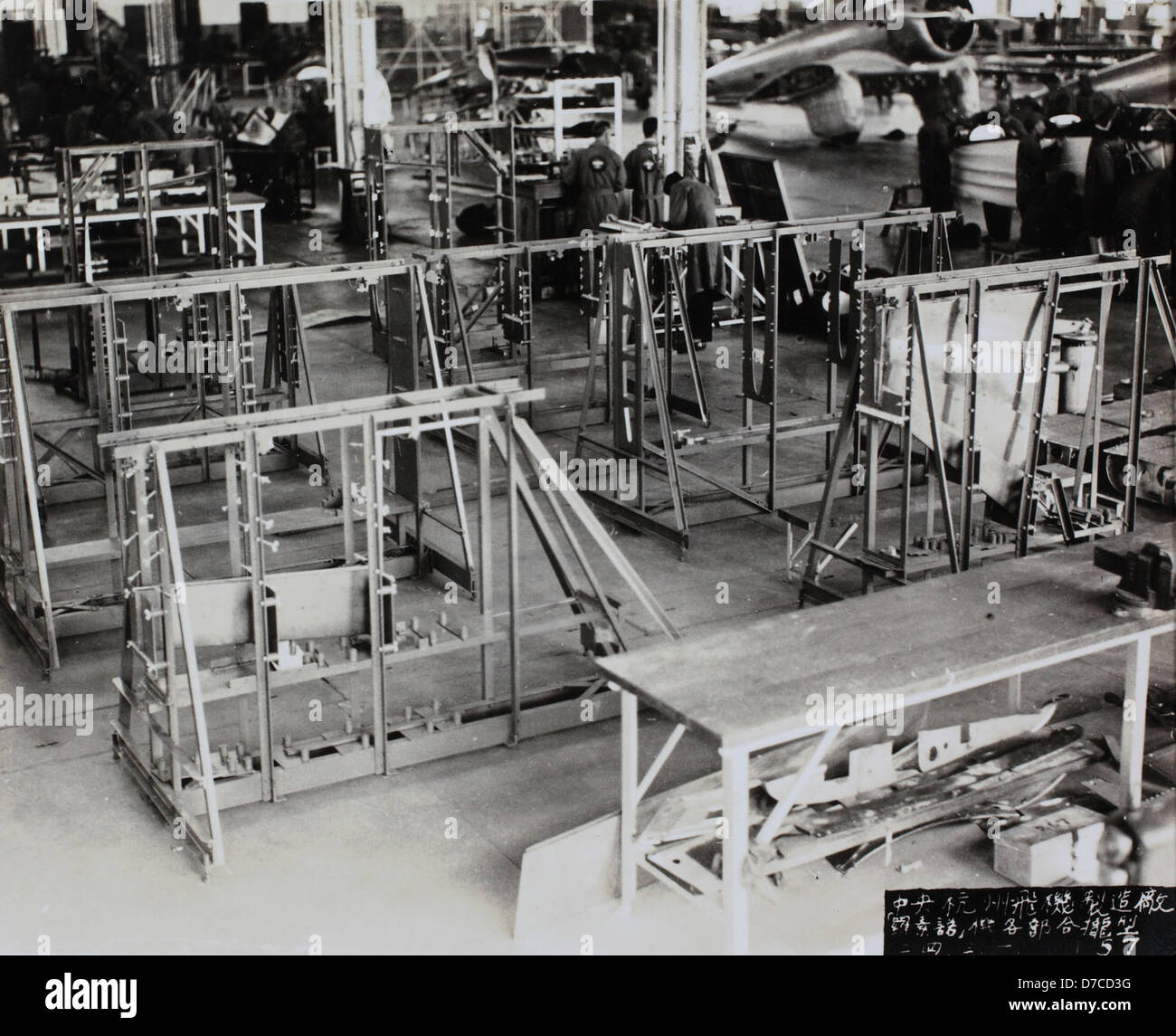 The factory floor showcases workers involved in the assembly of ...