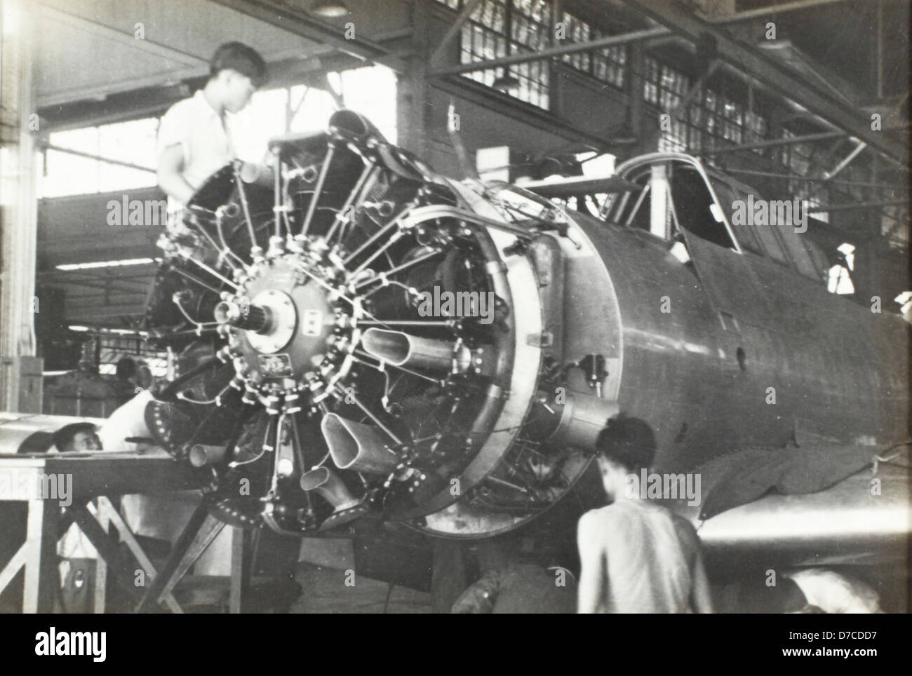 This image shows workers assembling an aircraft, highlighting the ...
