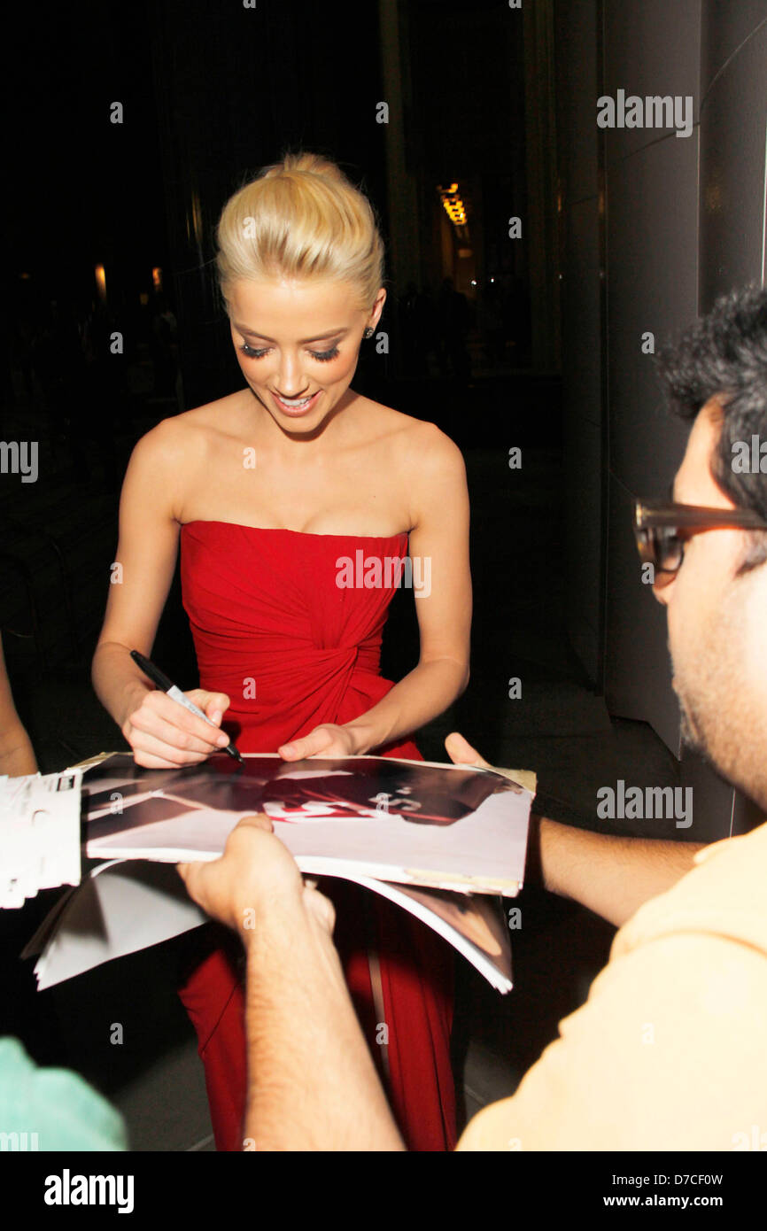 Amber Heard signs autographs for fans 'The Rum Diary' premiere held at ...