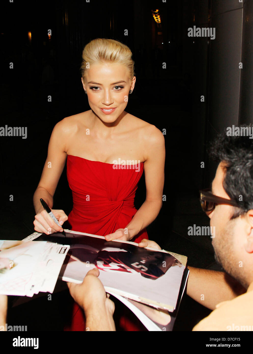 Amber Heard signs autographs for fans 'The Rum Diary' premiere held at ...