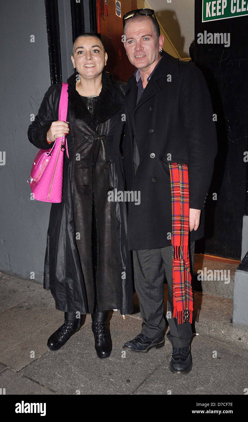 Singer Sinead O'Connor and Gavin Friday leave by the stage door of the ...