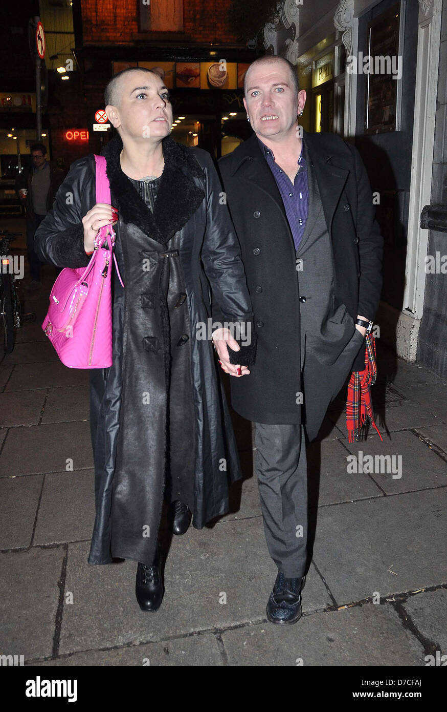 Singer Sinead O'Connor and Gavin Friday leave by the stage door of the ...