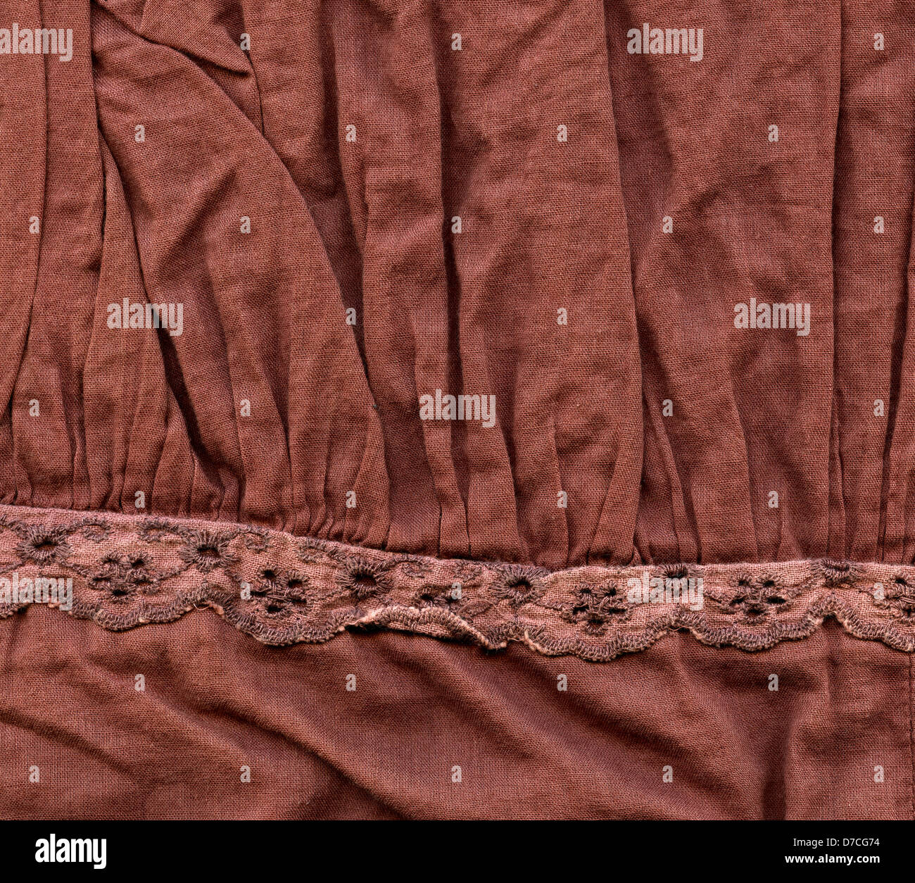 High resolution close up of brown cotton fabric with decorations ...