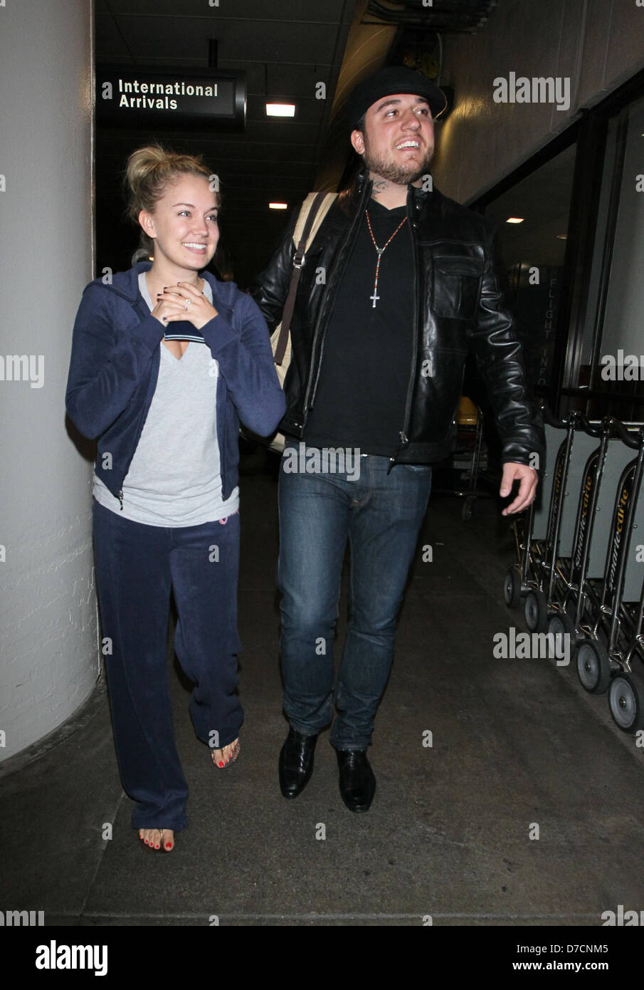 Tiffany Thornton and her fiance Christopher Carney arrive at LAX ...