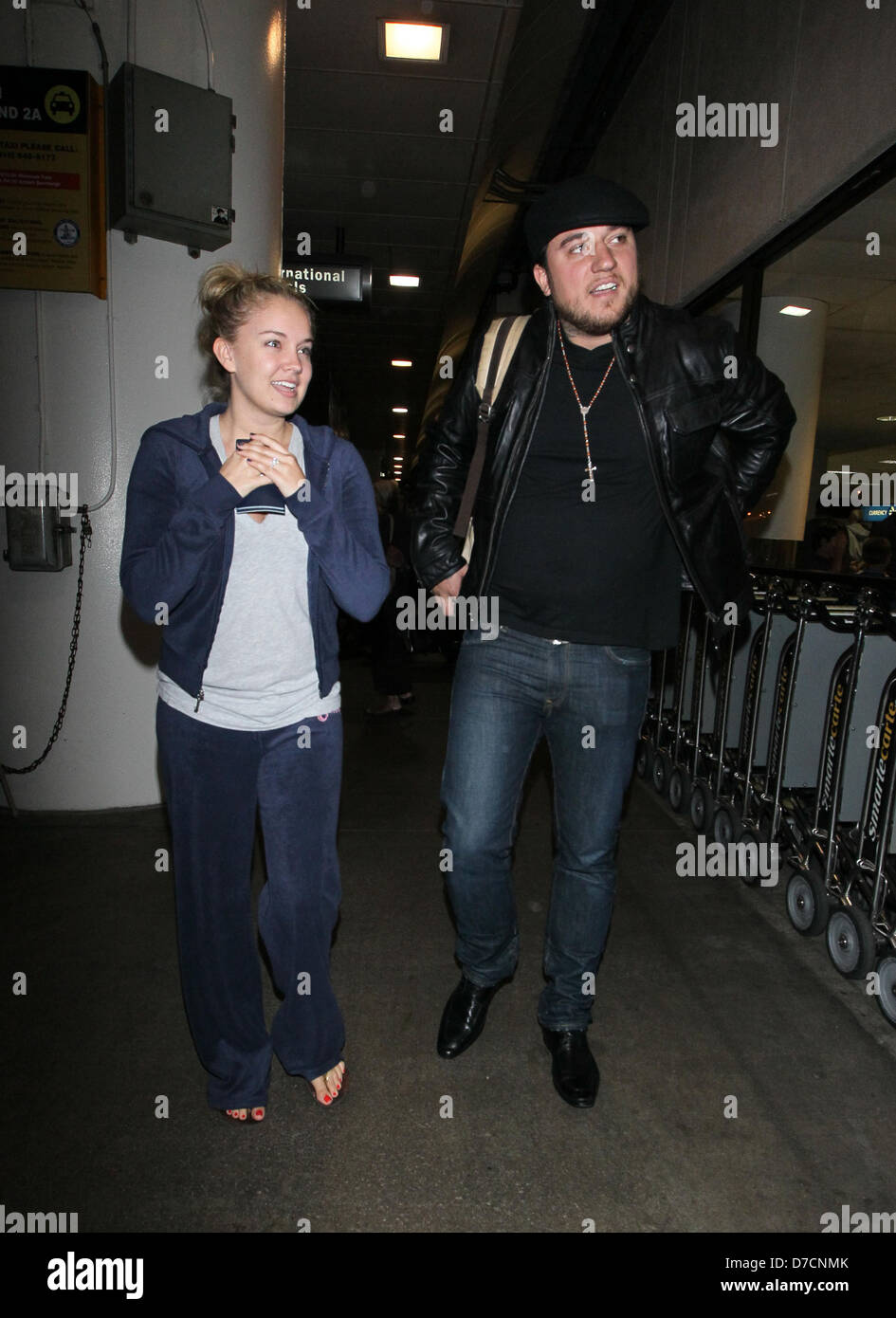 Tiffany Thornton and her fiance Christopher Carney arrive at LAX ...