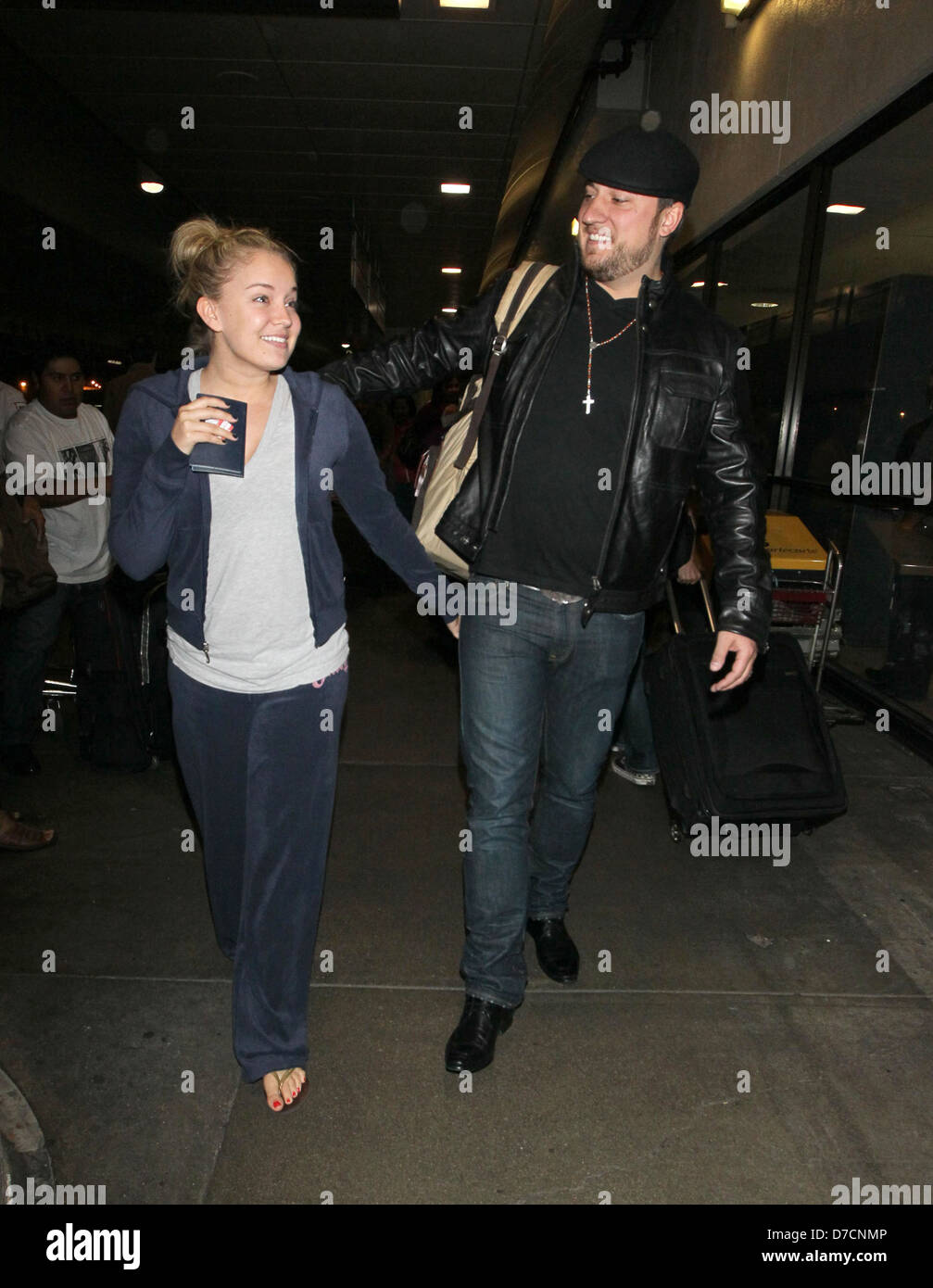 Tiffany Thornton and her fiance Christopher Carney arrive at LAX ...