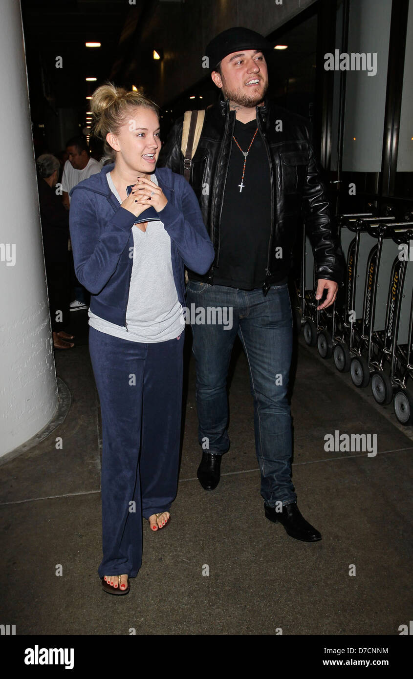 Tiffany Thornton and her fiance Christopher Carney arrive at LAX ...