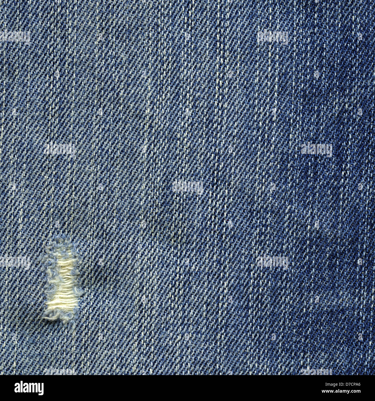 High resolution scan of blue denim fabric with a worn-out look. Scanned ...