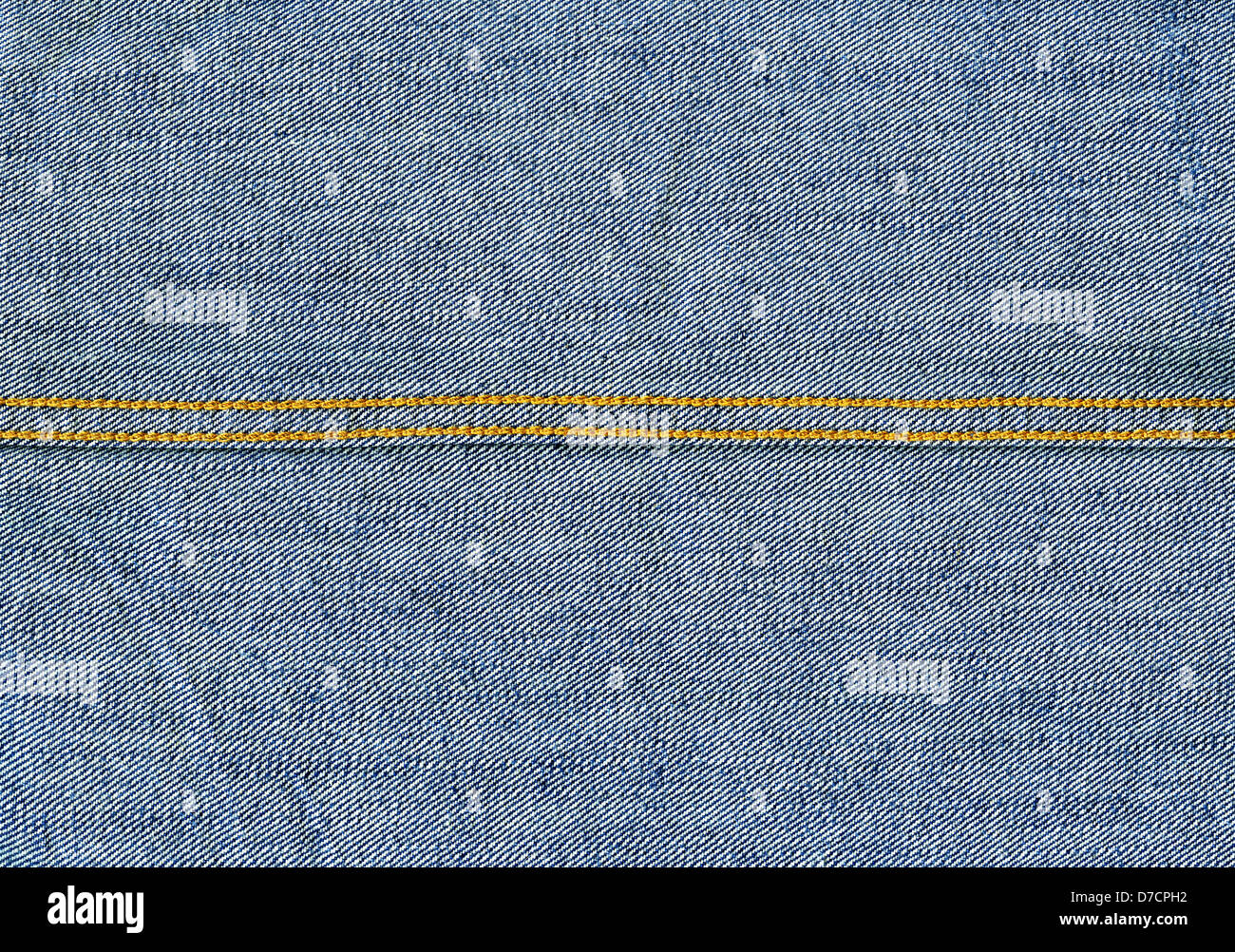 High resolution scan blue denim fabric two horizontal yellow seams ...