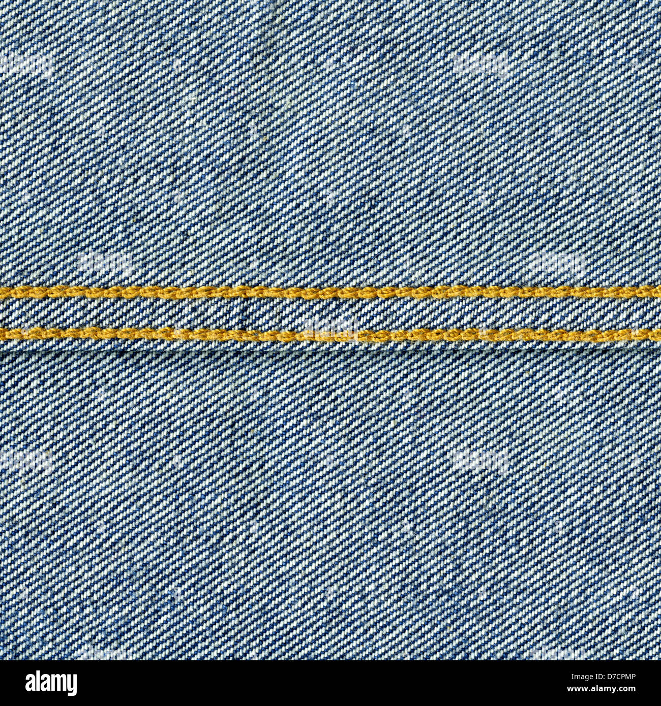 High resolution scan blue denim fabric two horizontal yellow seams ...