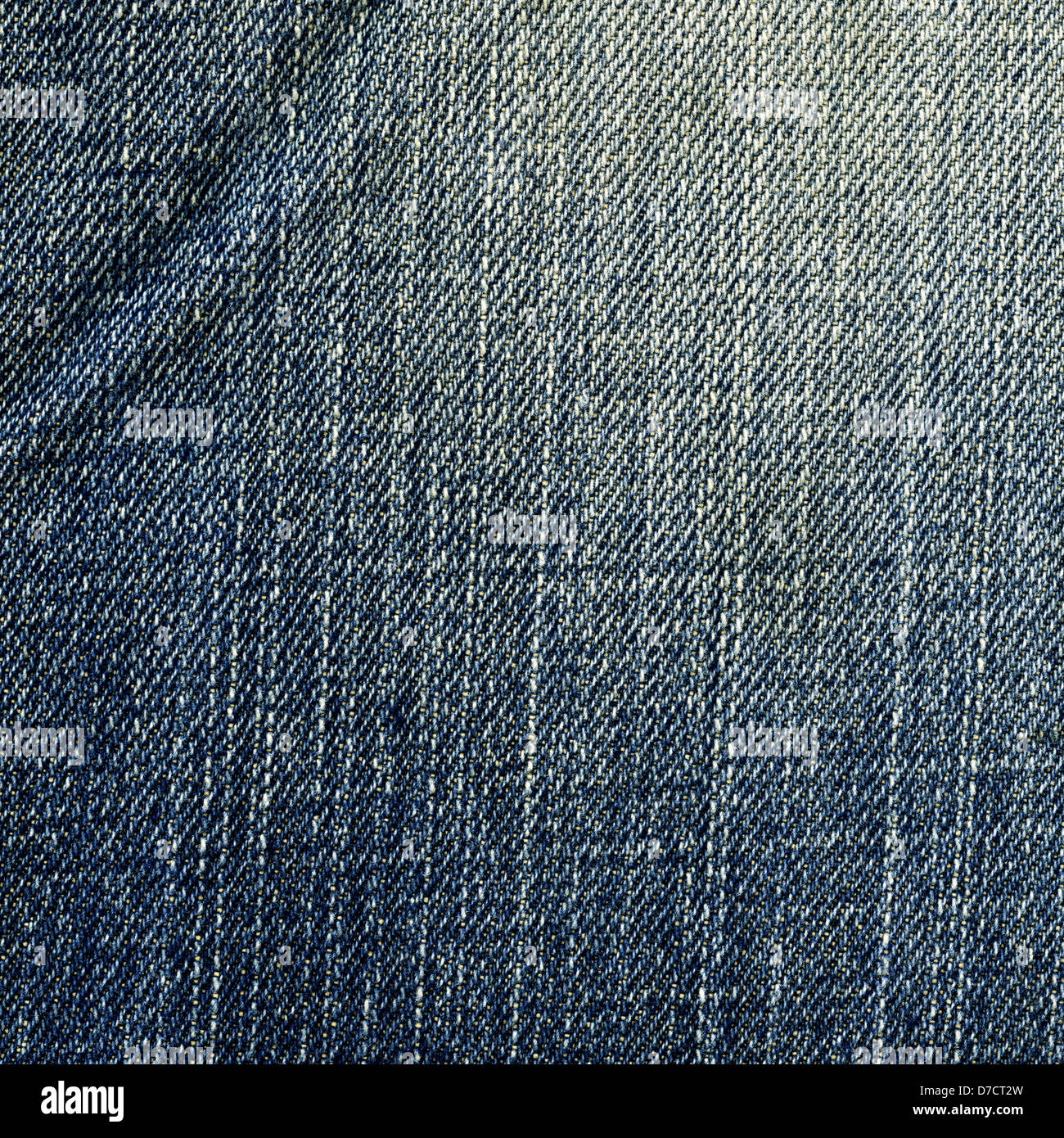 High resolution scan of blue denim fabric with a worn-out look. Scanned ...