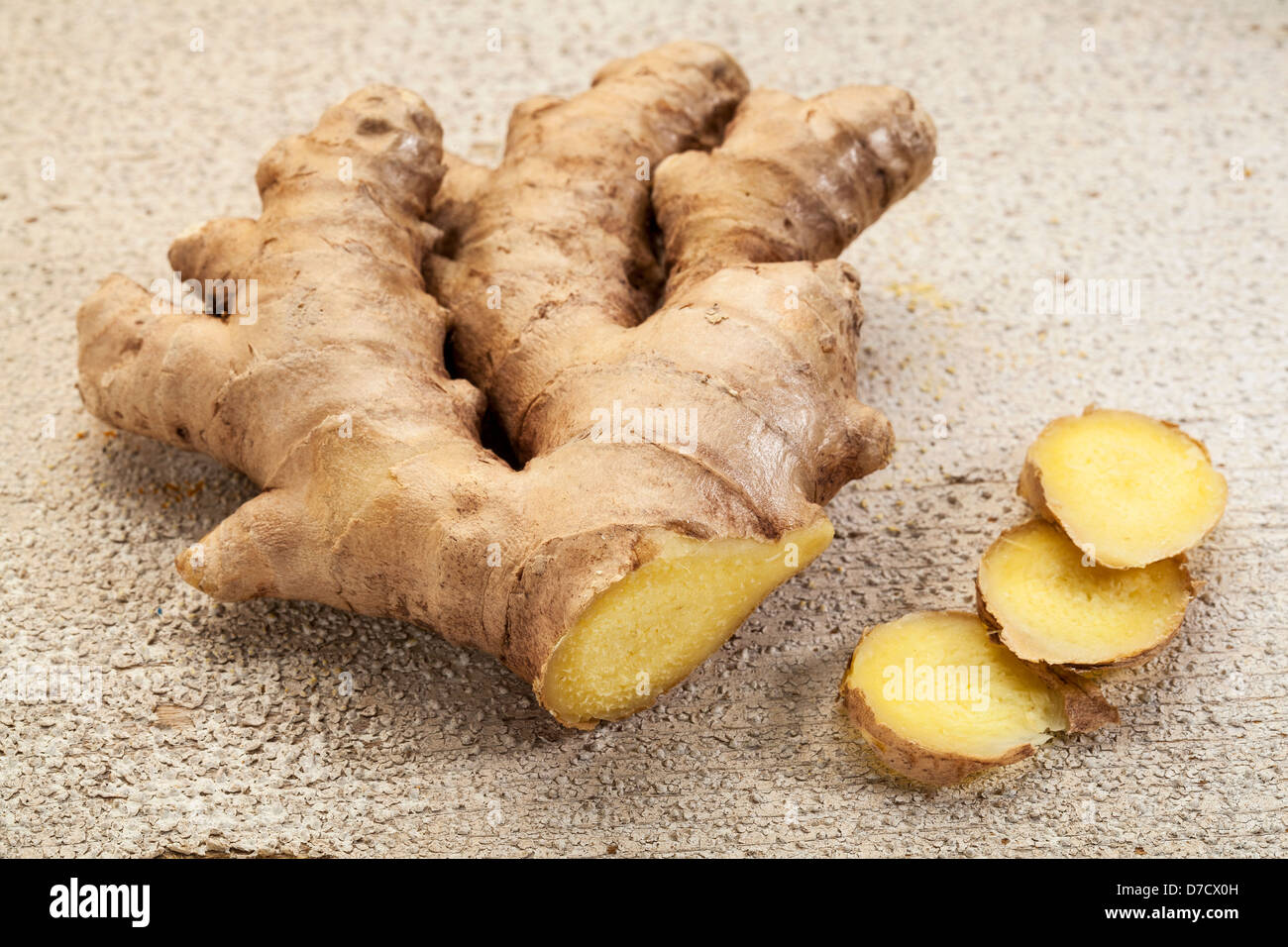ginger root slices on a rustic white painted barn wood background Stock ...