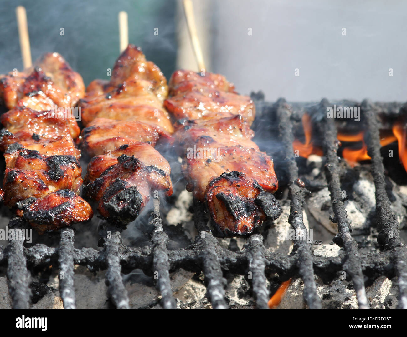 Grilling Chicken on Sticks Stock Photo - Alamy