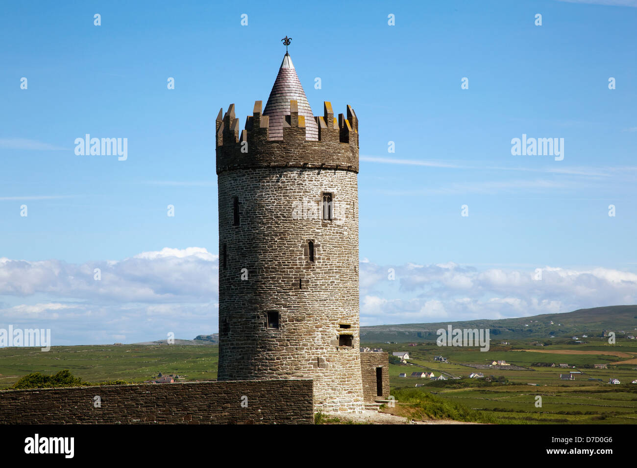 Doonagore castle a round 16th-century tower house with a small walled ...