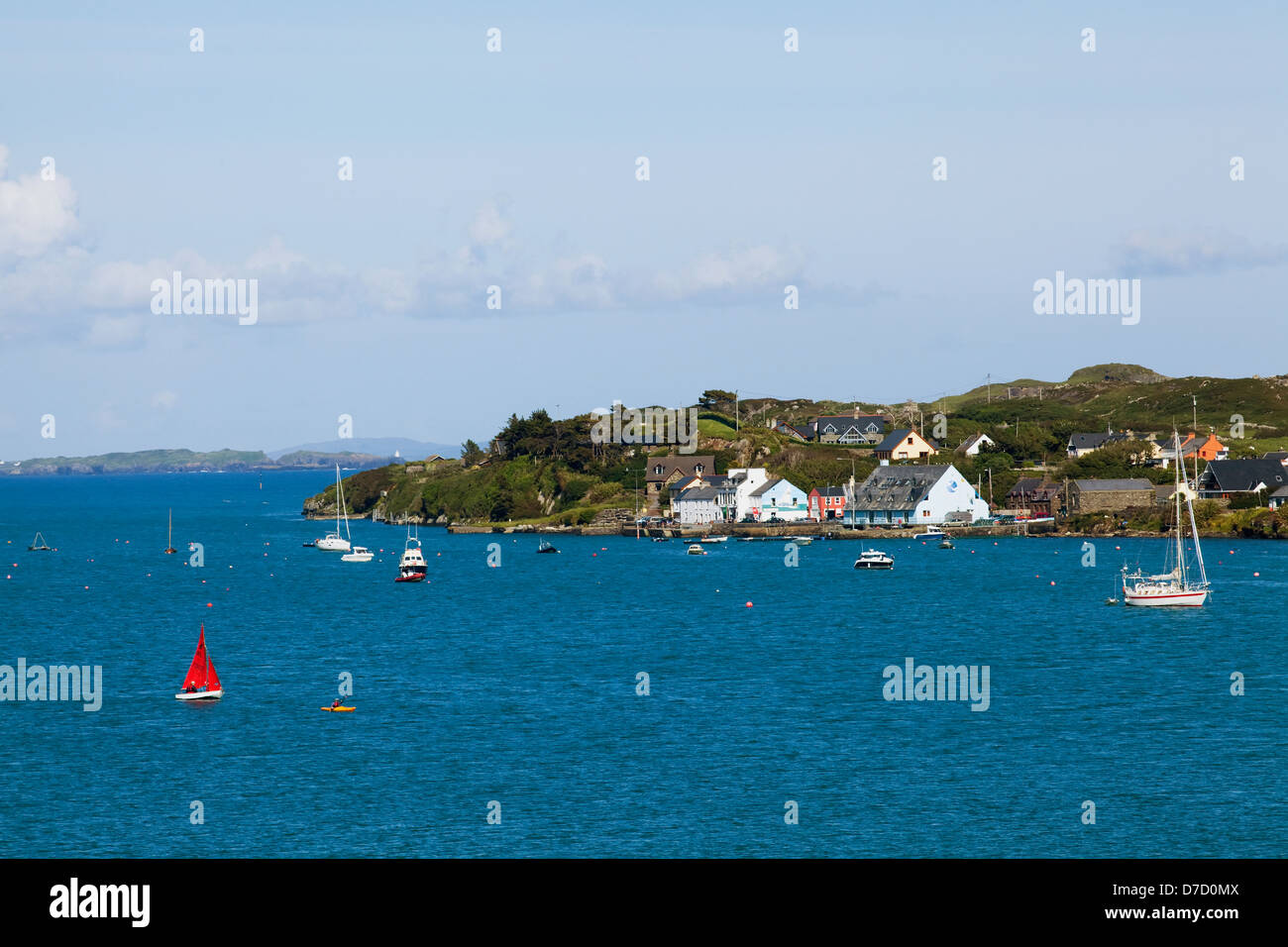 Houses along the coast and boats in the water;Crookhaven county cork ...