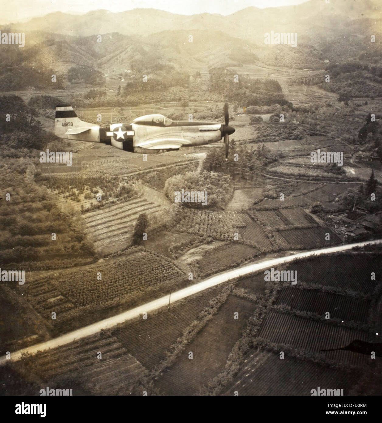 Aerial photograph taken by Charles Daniels of an F-6 aircraft flying ...