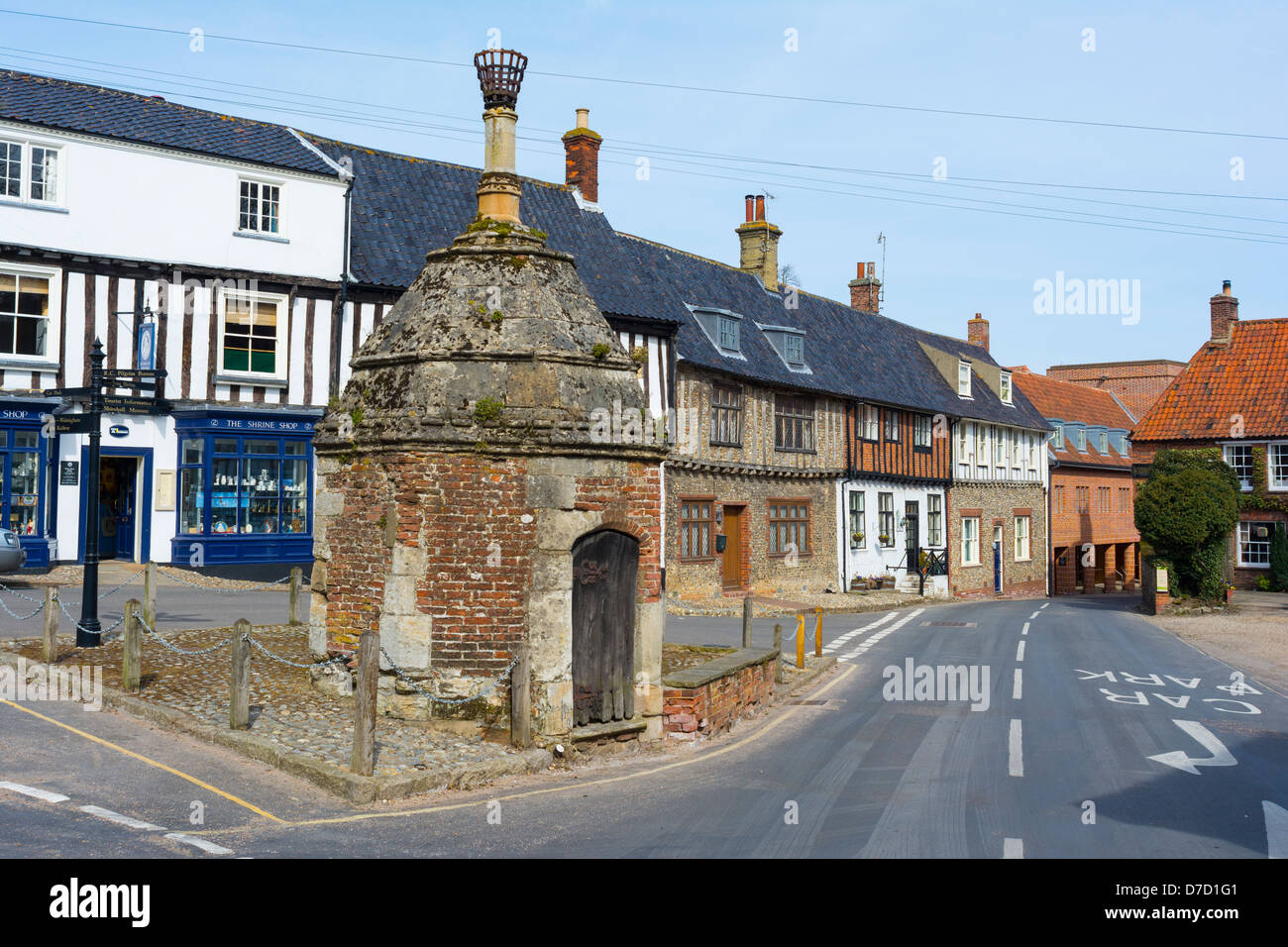 Little Walsingham village center, showing the old pump and brazier ...