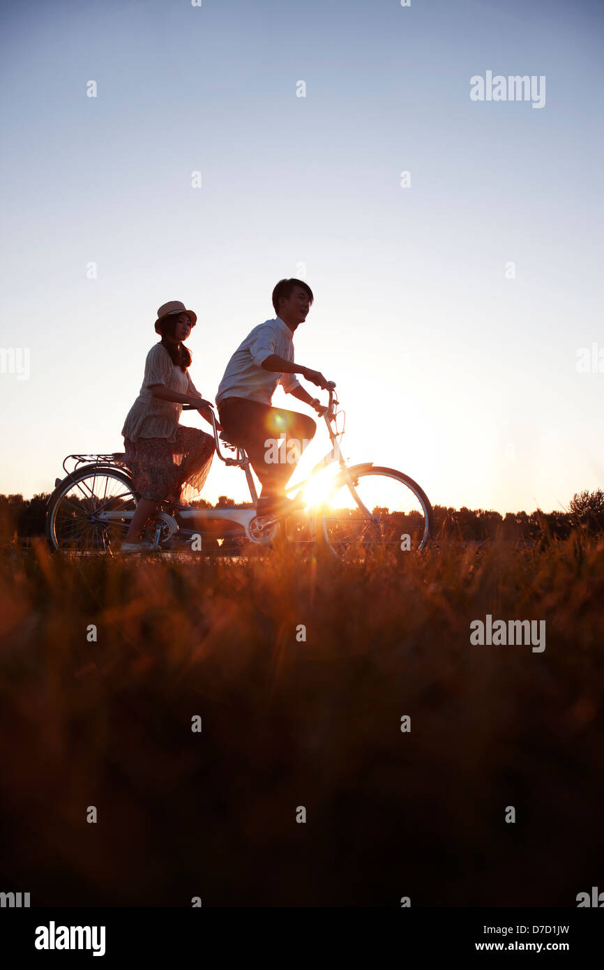 Side view romantic couple riding hi-res stock photography and images ...