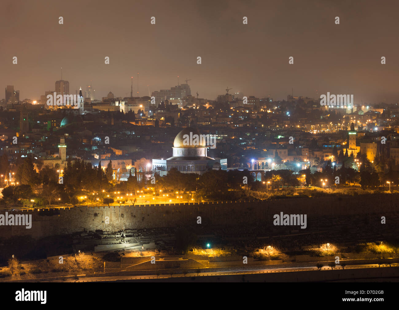 The Jerusalem skyline at night showing the golden dome of the Islamic Dome of the Rock, viewed ...