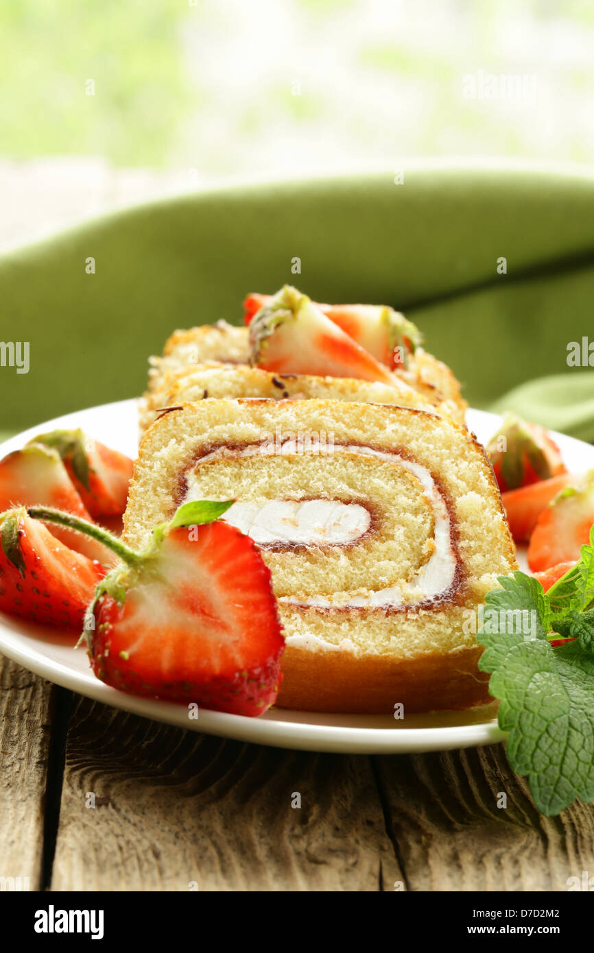 roulade cake with cream and fresh strawberries Stock Photo - Alamy