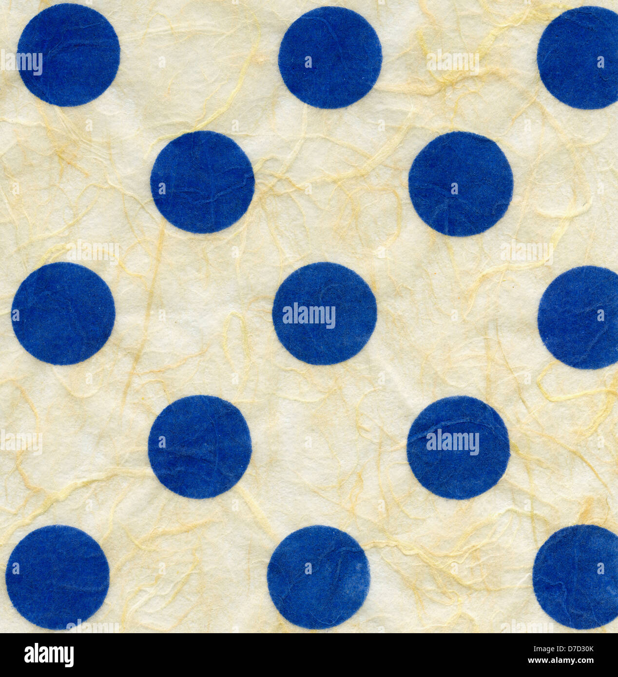 High resolution scan blue polka dots on yellowish-white rice paper ...