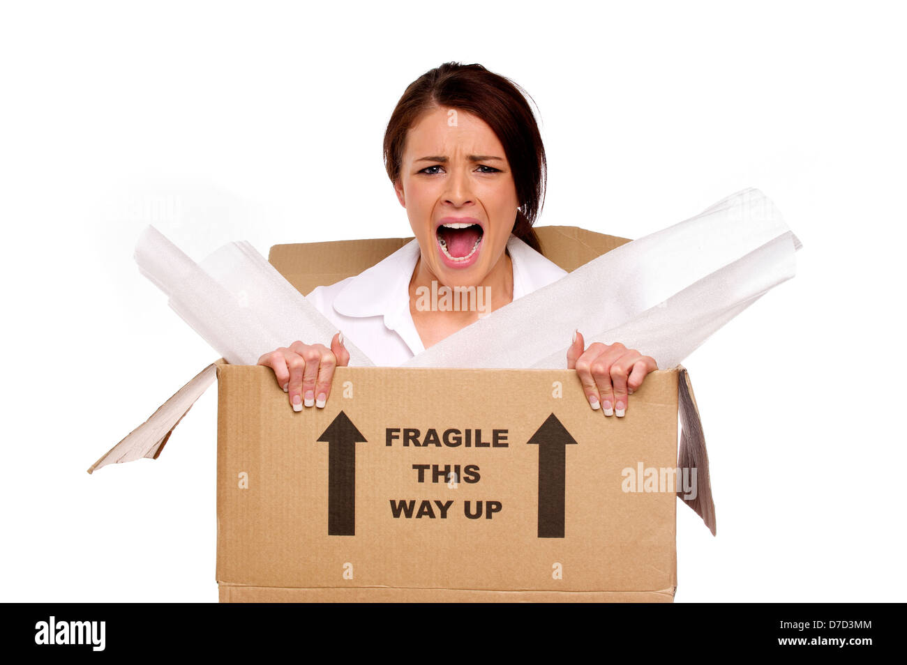 Beautiful business woman stuck in a cardboard box isolated on a white ...