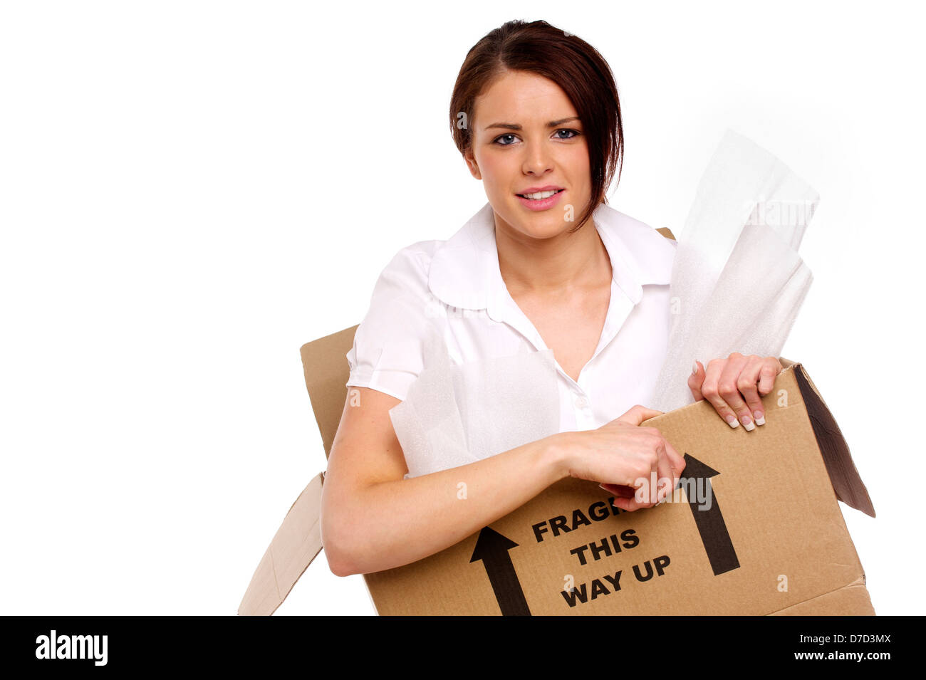 Beautiful business woman stuck in a cardboard box isolated on a white ...