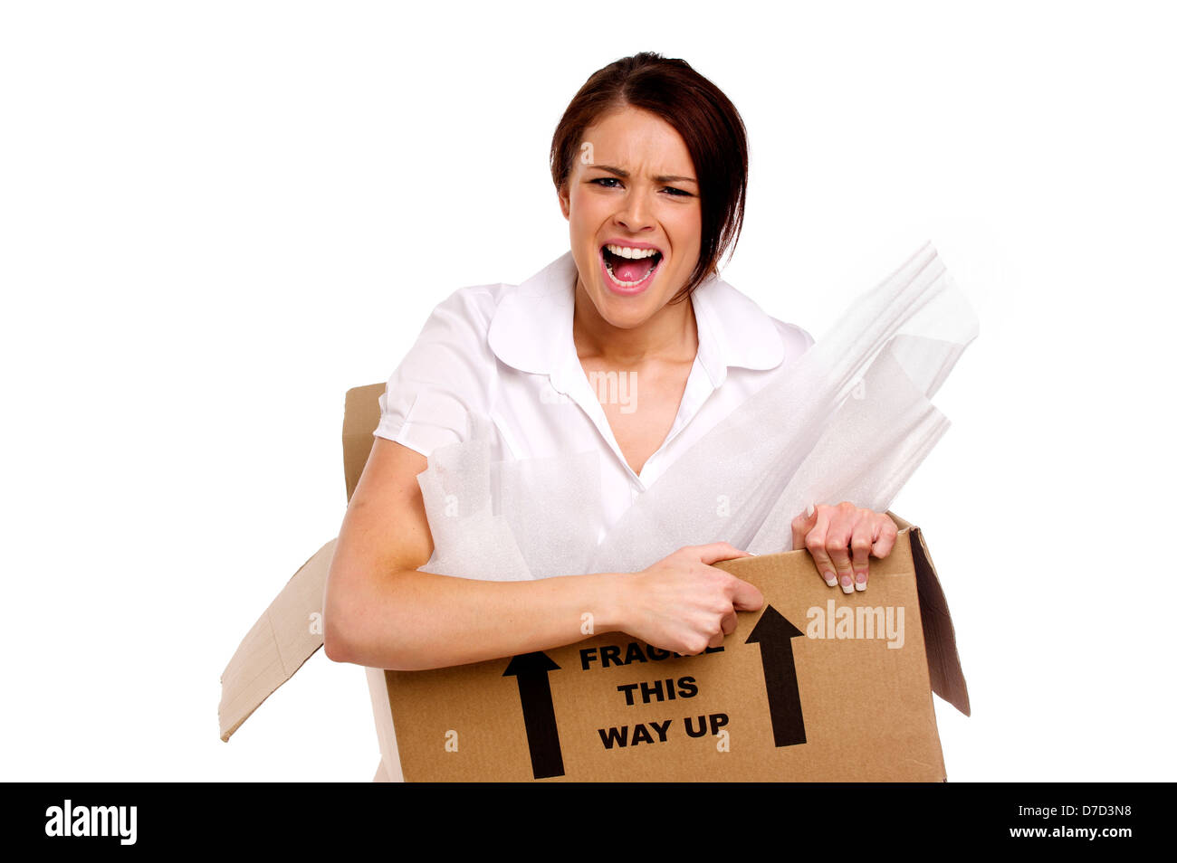 Beautiful business woman stuck in a cardboard box isolated on a white ...