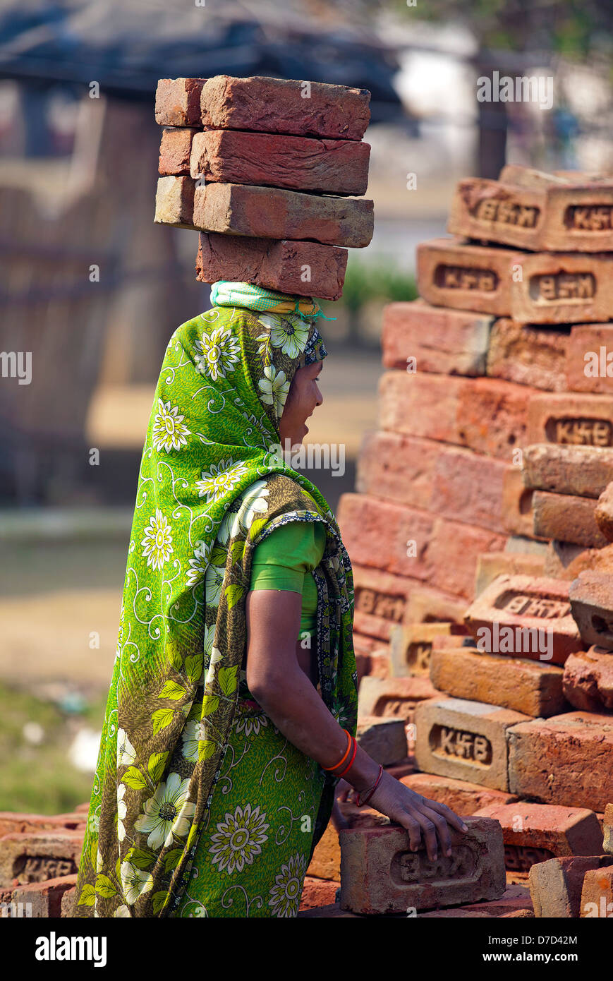Women carrying bricks hi-res stock photography and images - Alamy