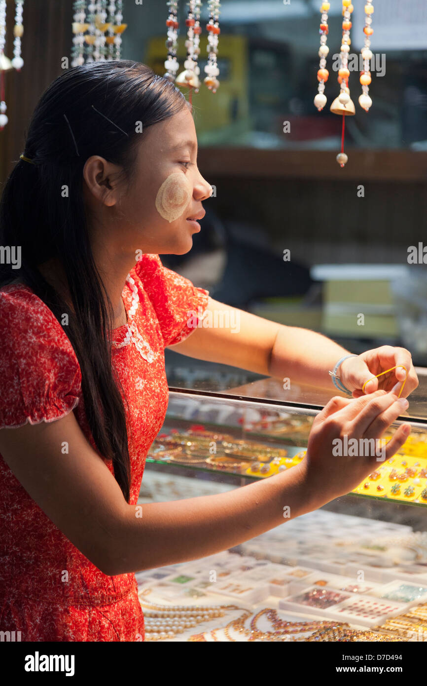 A young Burmese girl with Thanaka face decoration in Bogyoke (formerly ...