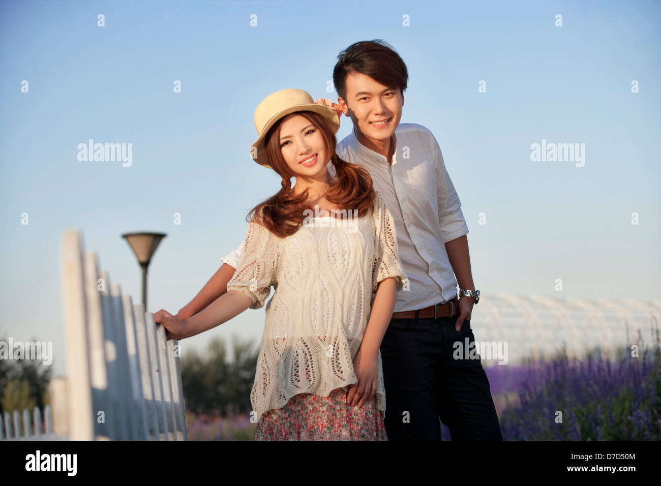 The young couple back to back Stock Photo - Alamy