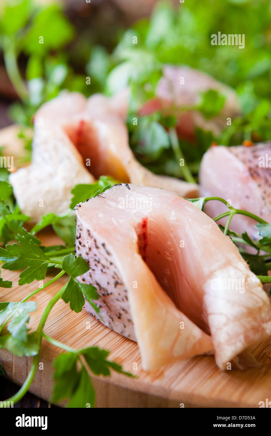 raw fillet of pike on the board and greens, fish Stock Photo - Alamy