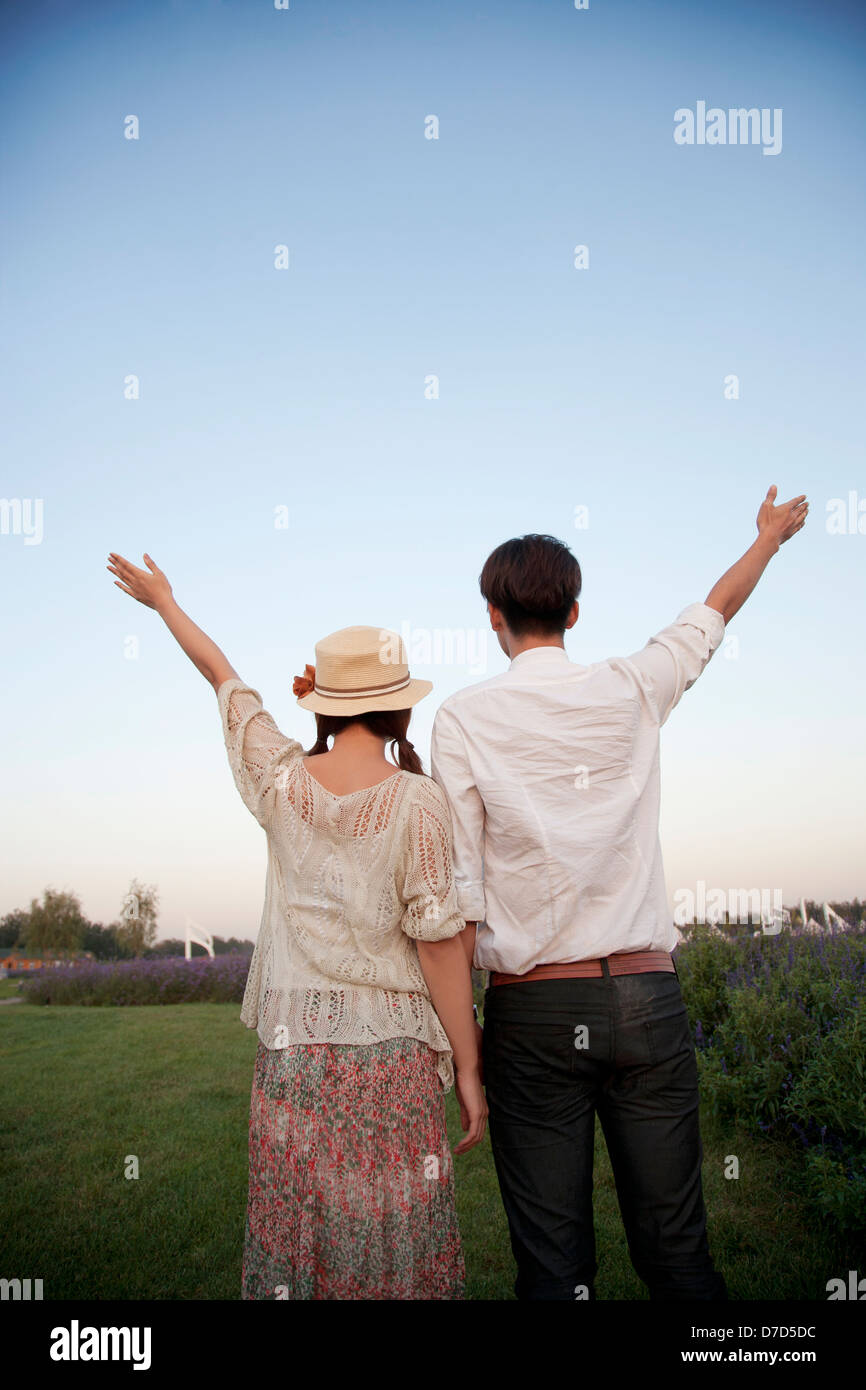 Young couple standing together Stock Photo - Alamy