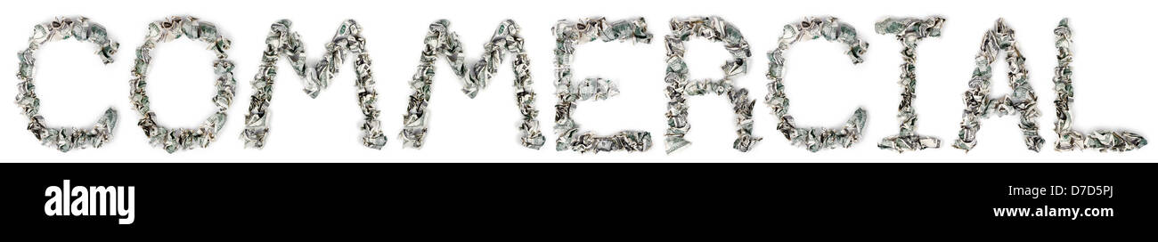 The word 'commercial', made out of crimped 100$ bills. Isolated on ...