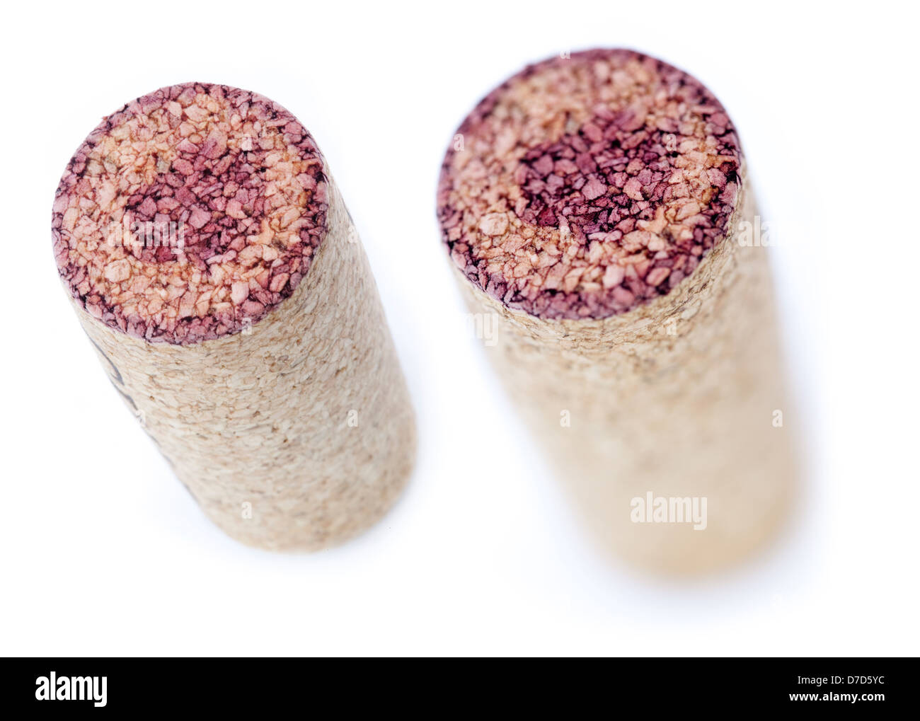 A red wine stained cork isolated on white background shot diagonally ...