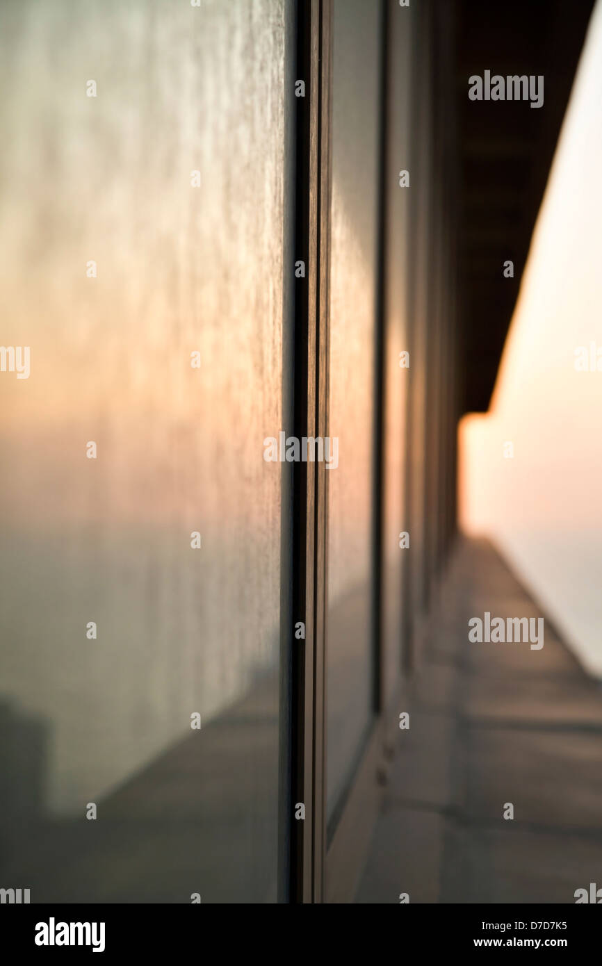 Building windows reflecting sunset time. Very shallow depth of field ...