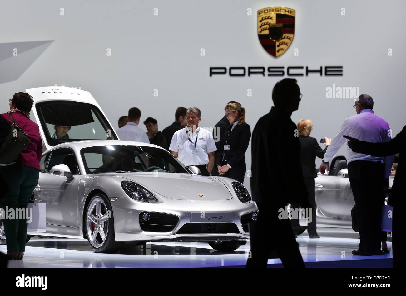 Shareholders of Porsche SE stand around a Porsche 911 GT3 during the ...
