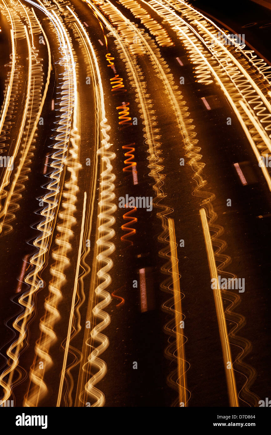 Squiggly trails light is all that remains from swift highway traffic ...