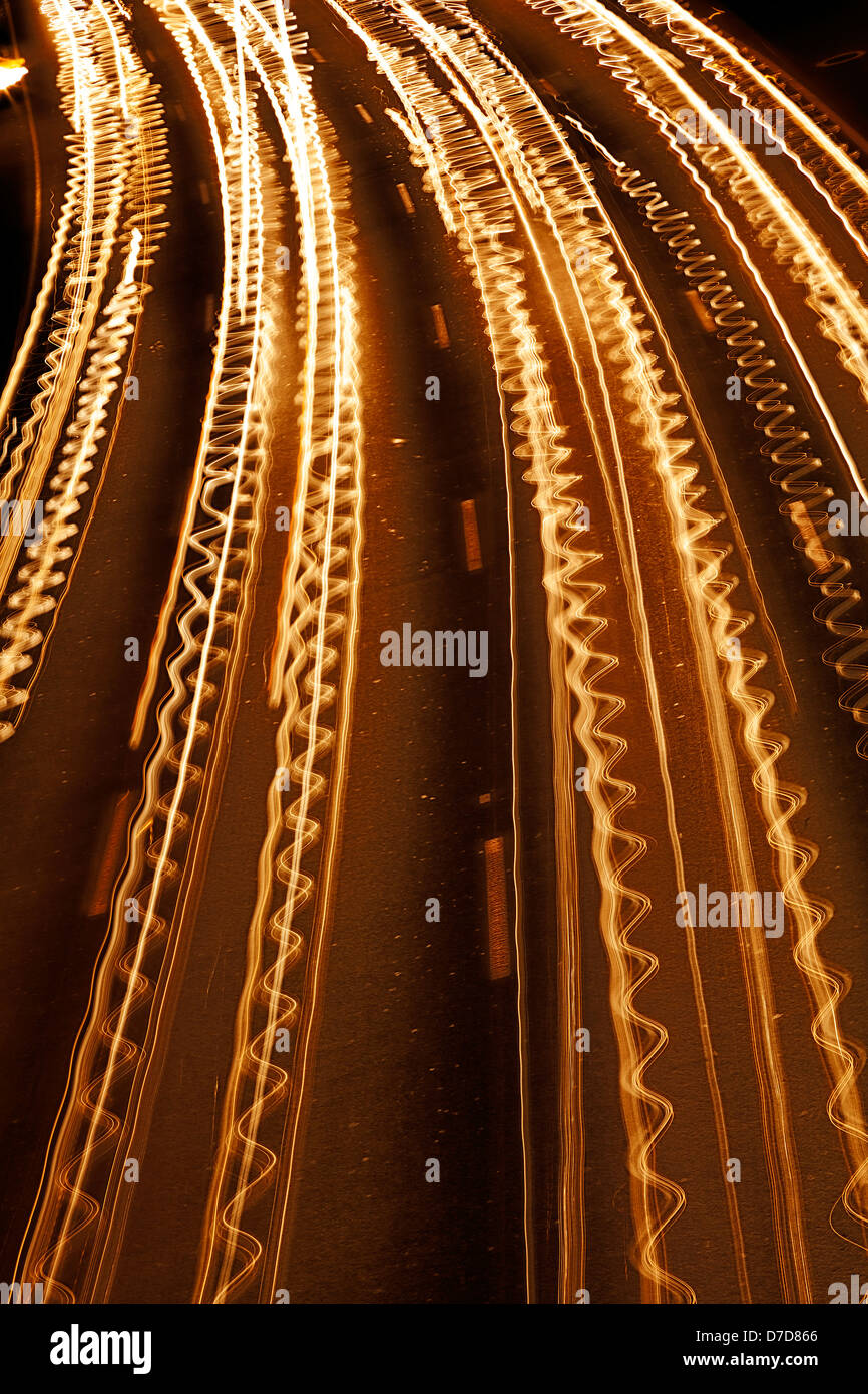 Squiggly trails light is all that remains from swift highway traffic ...