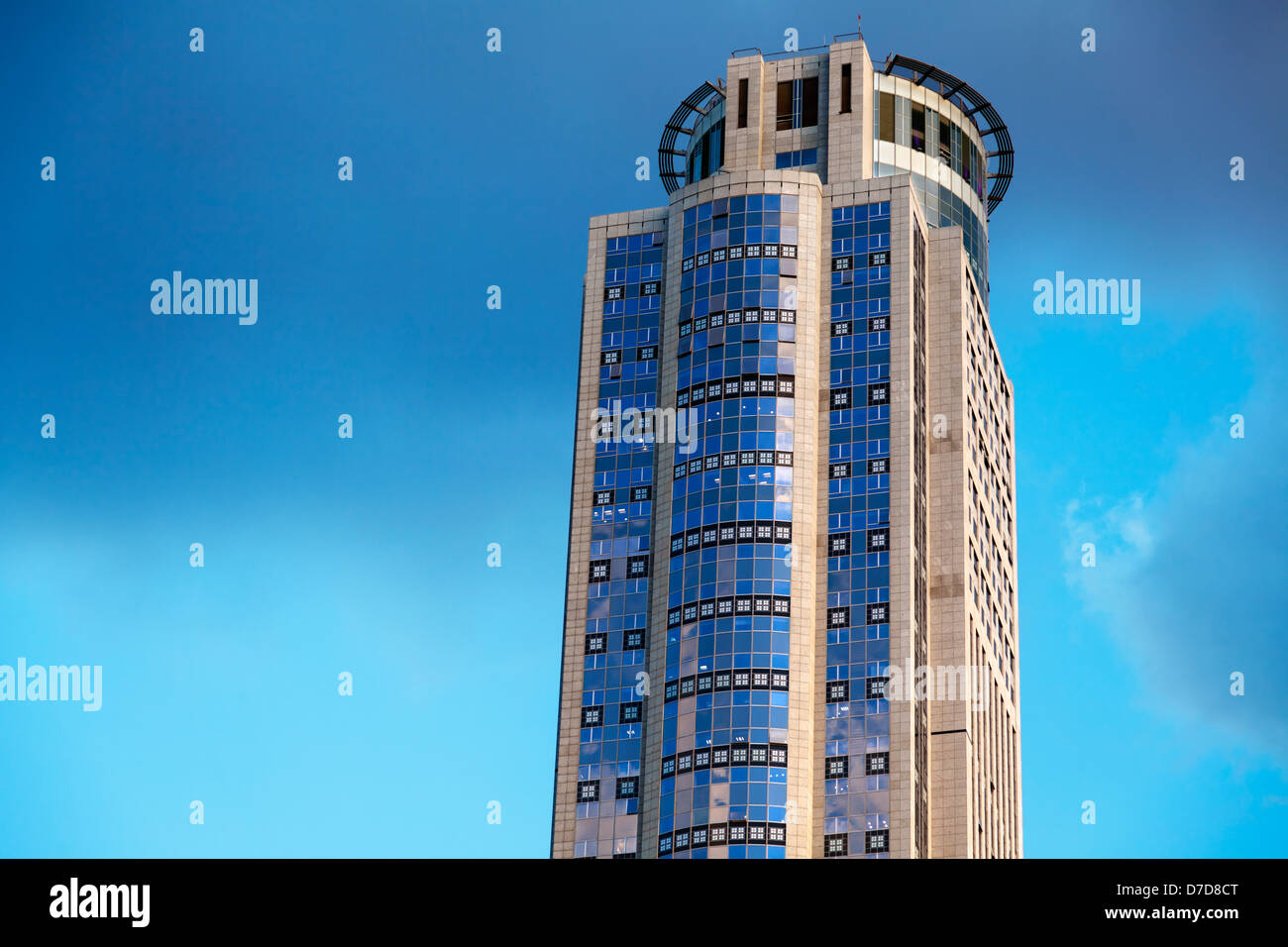 Top part of a super high skyscraper on the background of afternoon ...