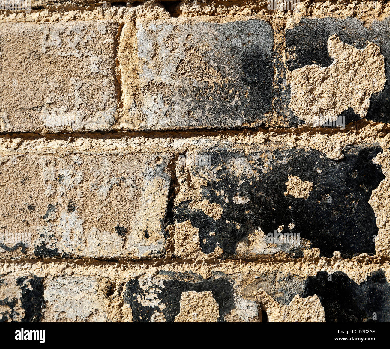 Close up of a brick wall covered with rough texture, which seems to be ...