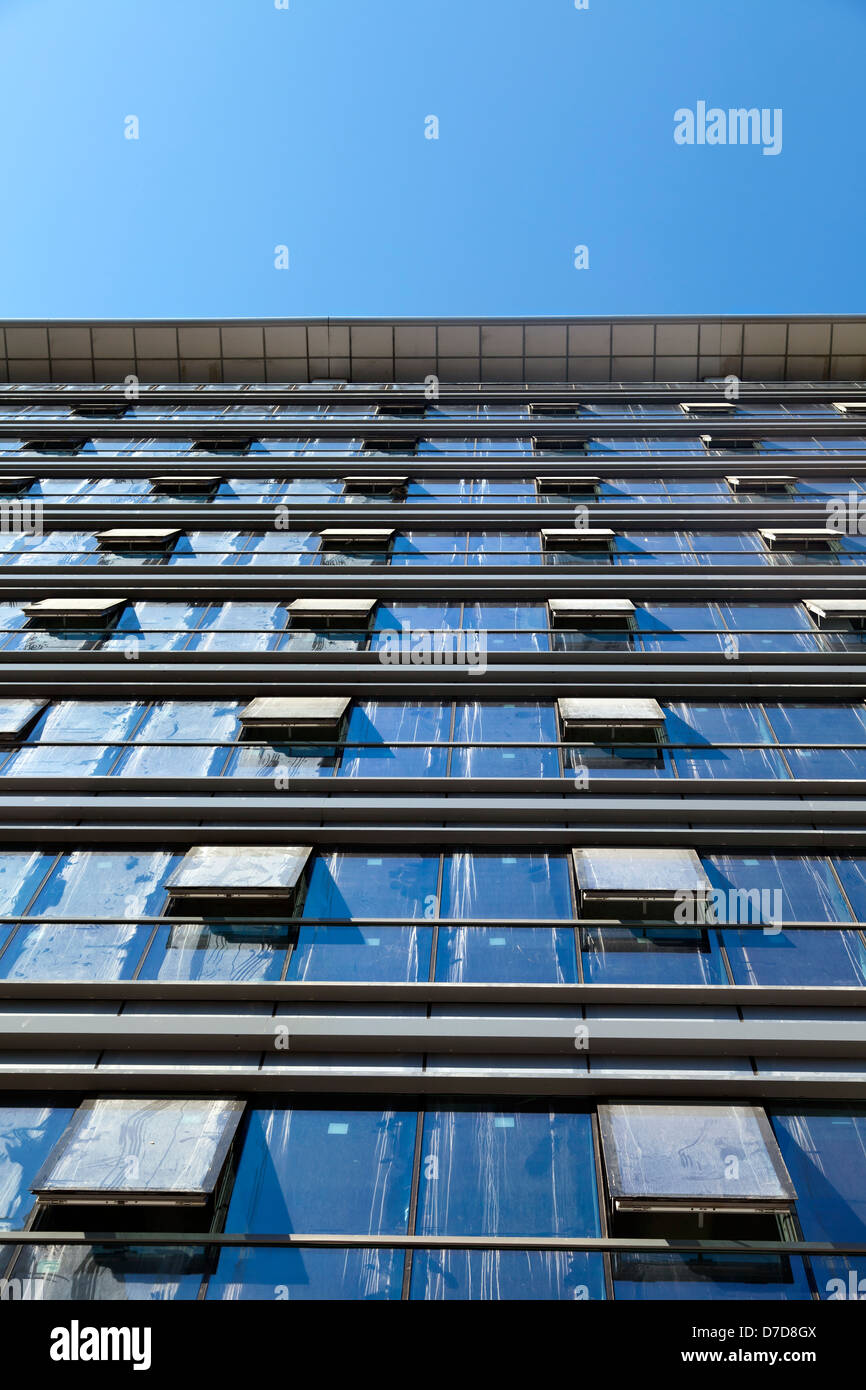 Extreme low angle shot of an office building, with all its dusty ...
