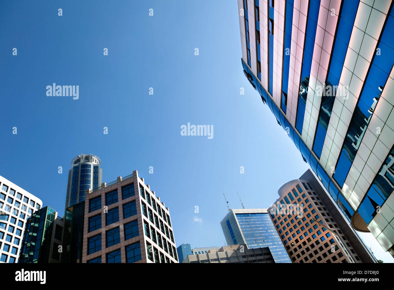Low & wide angle view of a tight froup of office buildings at the late ...