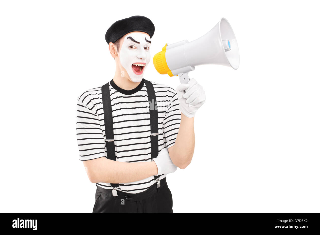 A male mime artist holding a loudspeaker and looking at camera isolated ...