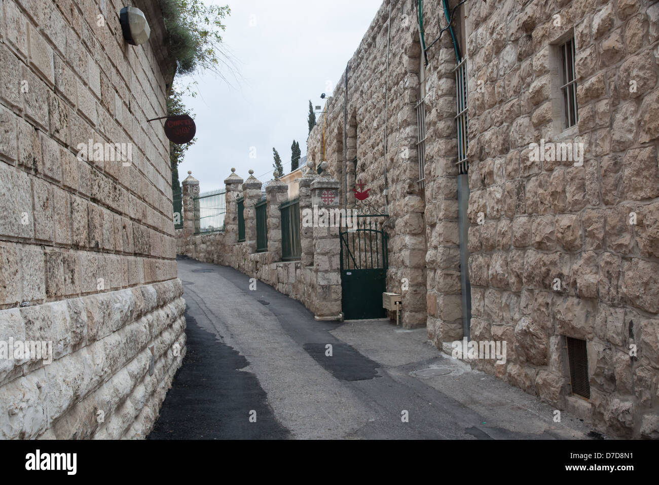 View down an narrow street in Jerusalem, Israel, withs tone buildings ...