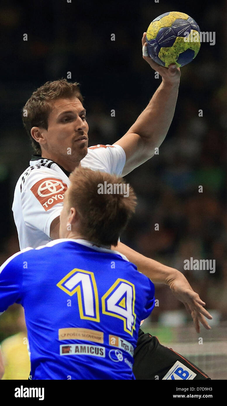 German Adrian Pfahl passes the ball next to Slovenian Nejc Cehte during ...