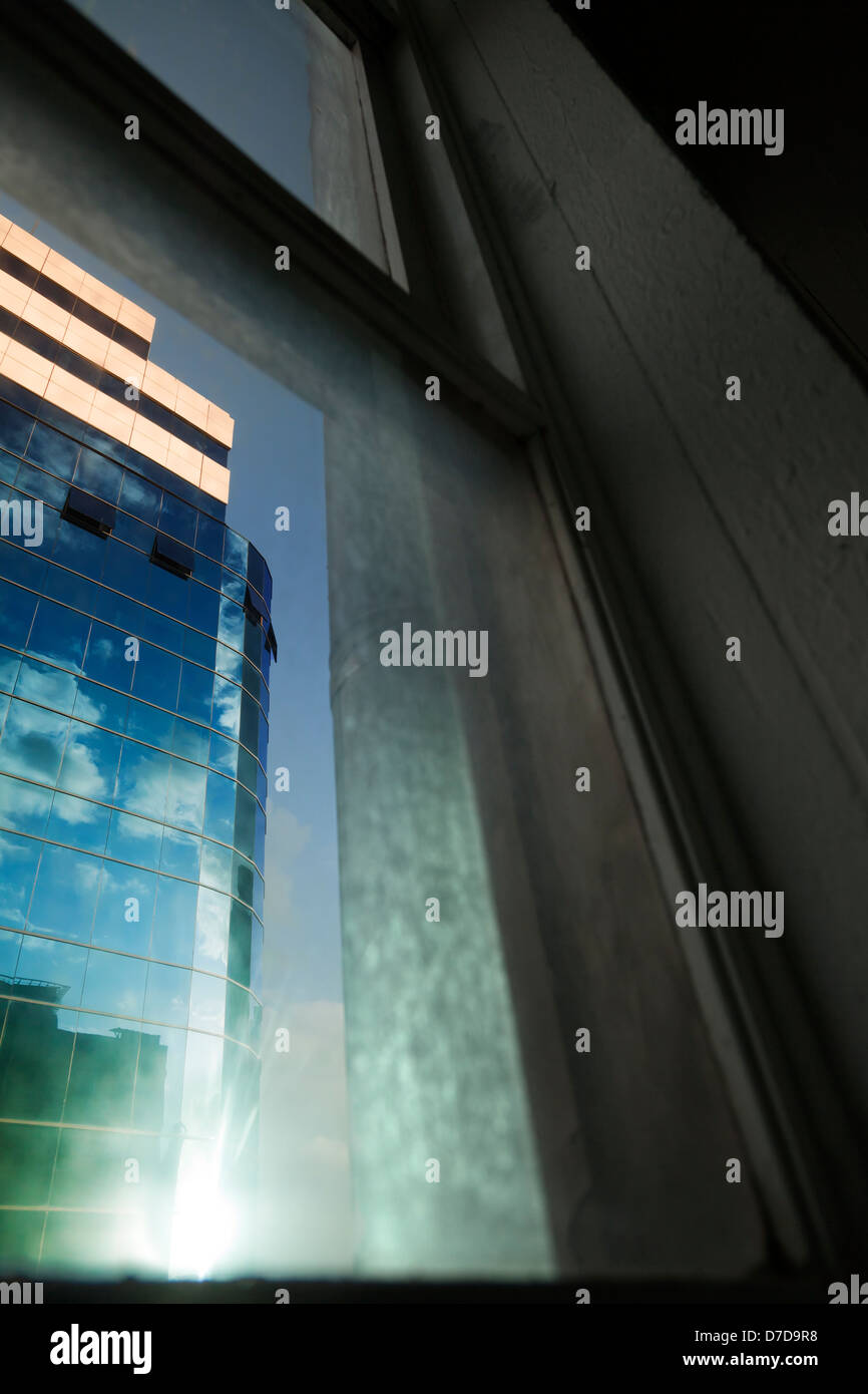 Low and very wide angle view of a window from inside, and through it an ...