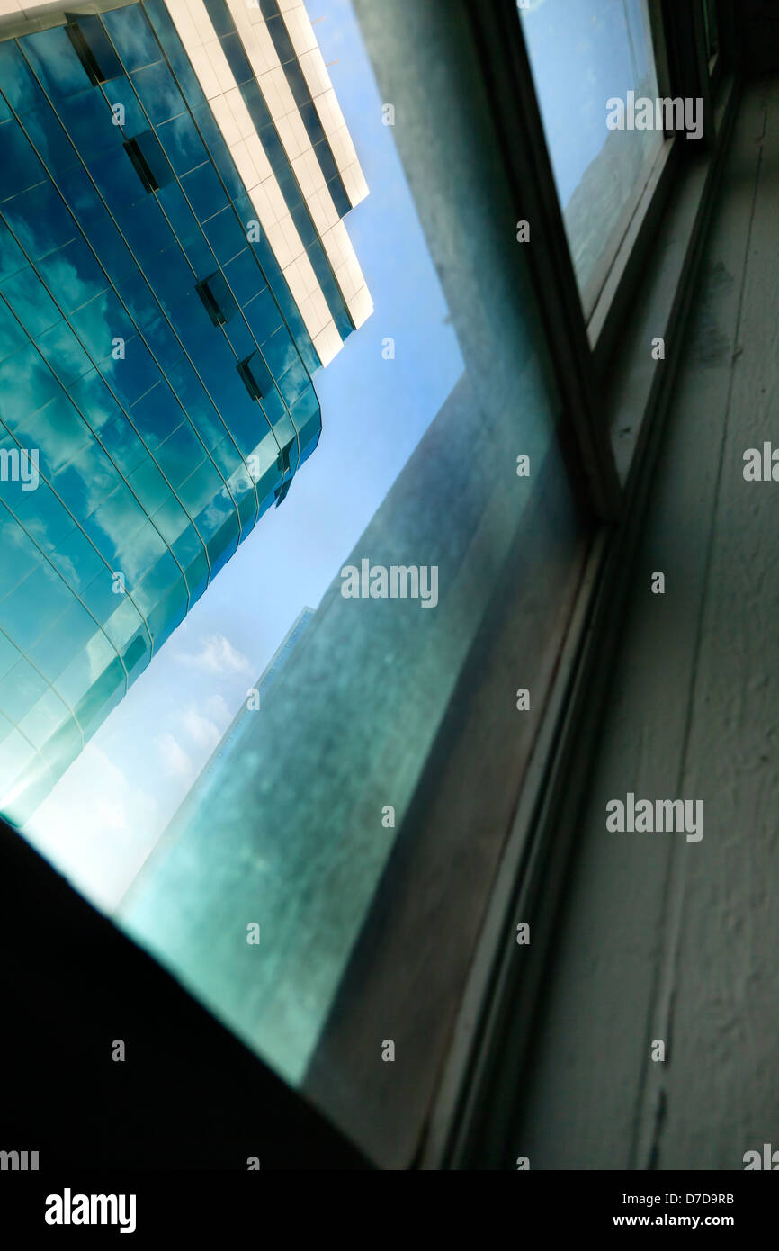 Low and very wide angle view of a window from inside, and through it an ...