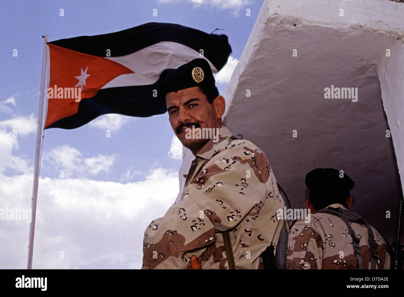 Jordanian soldier with national flag flapping in the wind, Jordan Stock ...
